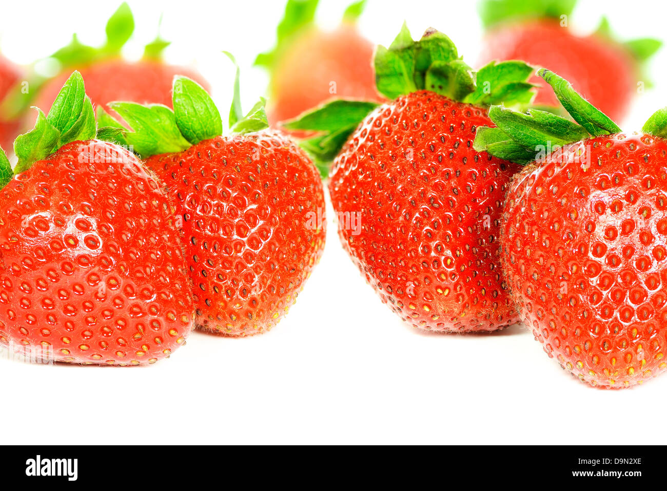 Strawberries against white background Stock Photo - Alamy
