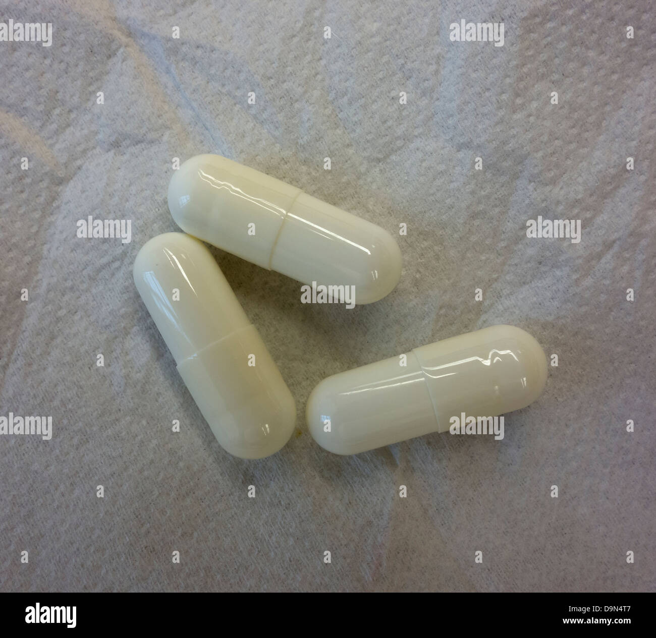 White capsules on napkin Stock Photo - Alamy