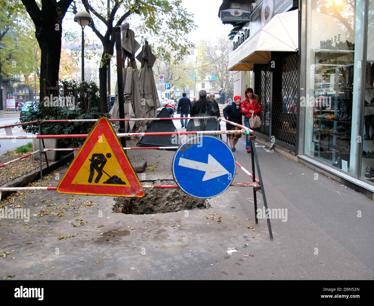 work in progress on the sidewalk,milan,italy Stock Photo - Alamy