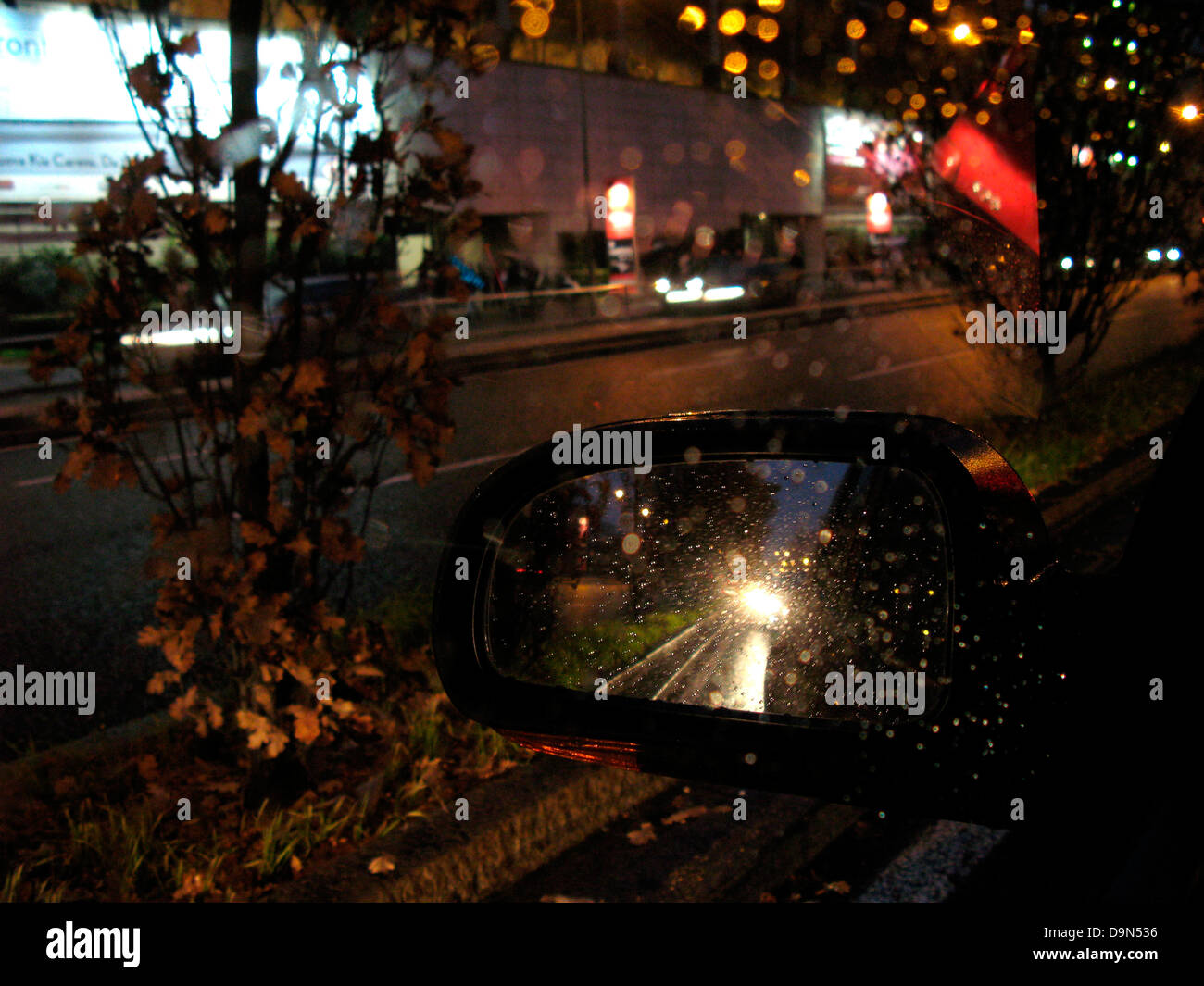 Rain in the city,traffic,rearview mirror Stock Photo - Alamy