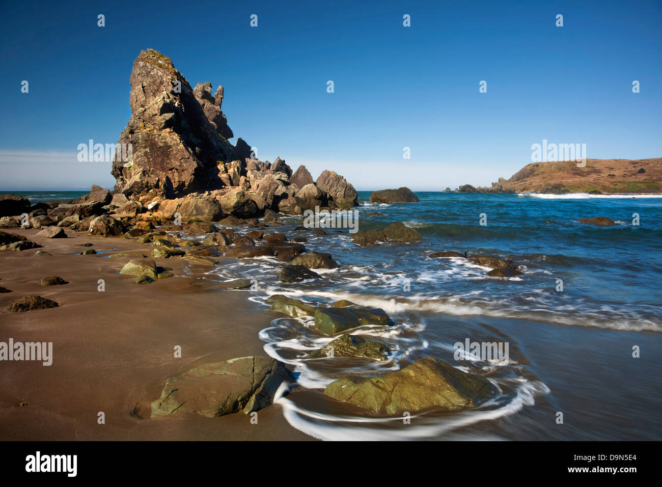 OREGON -In-coming tide at Lone Ranch Beach at the edge of the Pacific ...