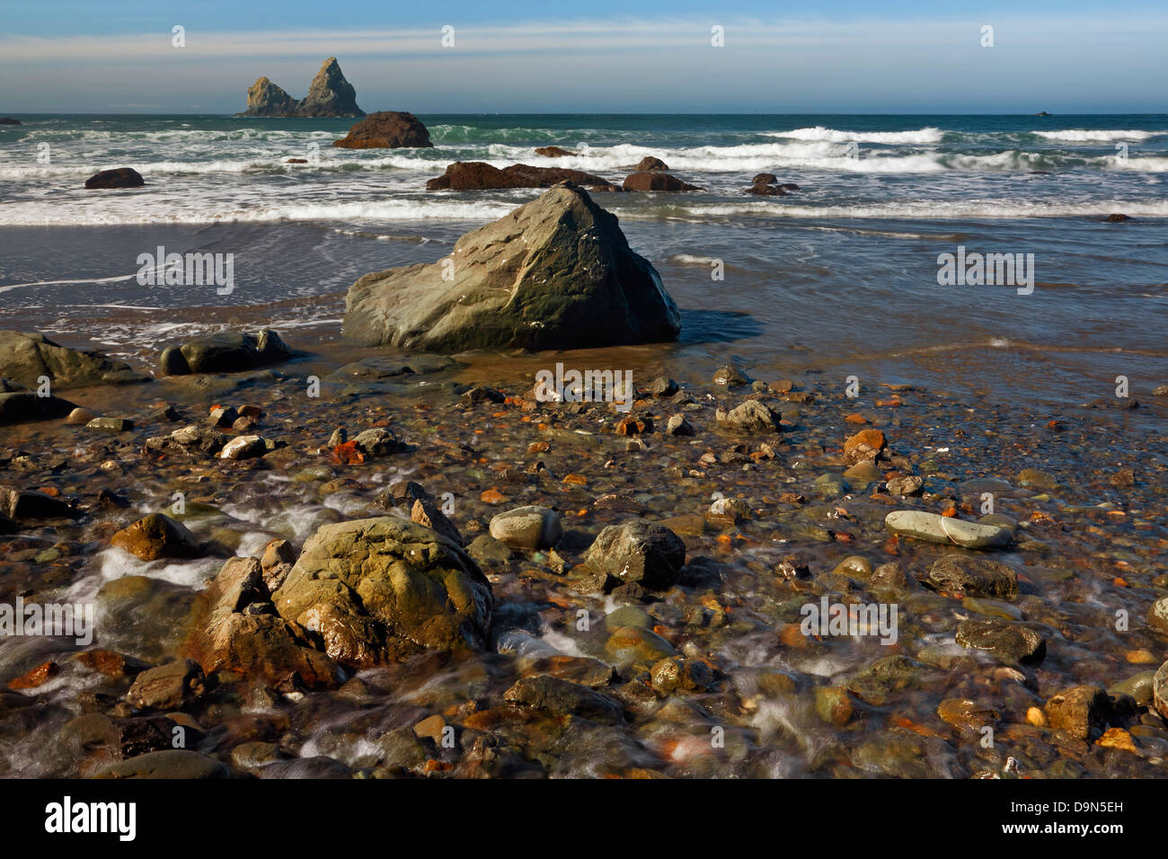 OREGON - Small creek crossing the sand on Lone Ranch Beach at the edge ...