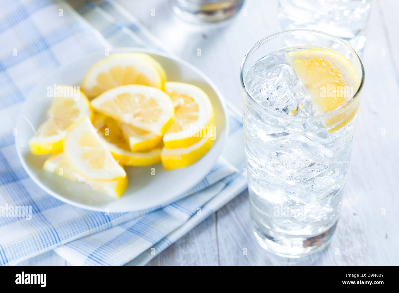 Refreshing Ice Cold Water with Lemon ready to drink Stock Photo - Alamy