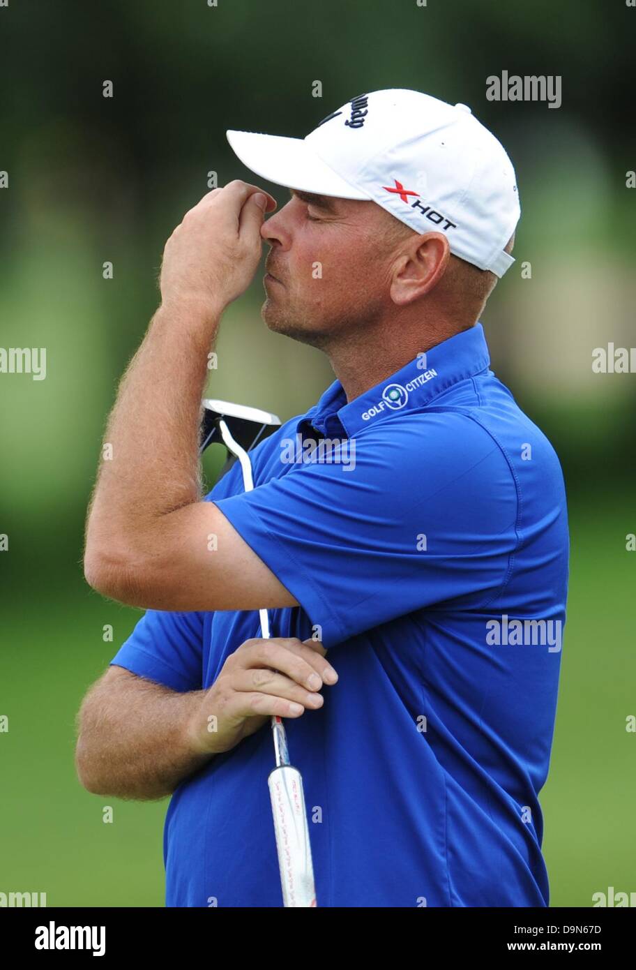 Danish golf pro Thomas Bjorn reacts during the Golf International Open ...