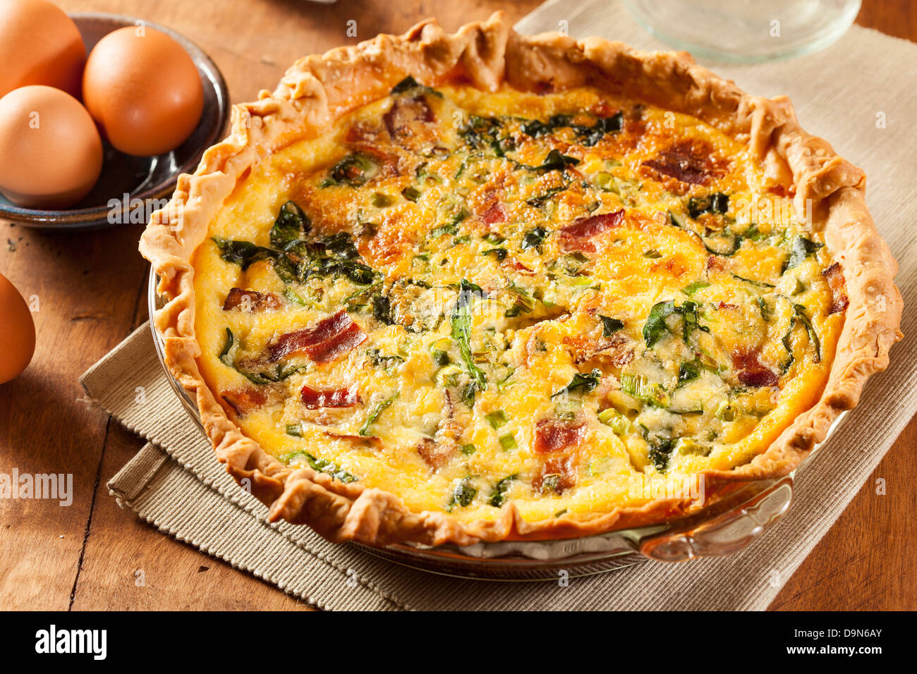 Homemade Spinach and Bacon Egg Quiche in a pie crust Stock Photo - Alamy
