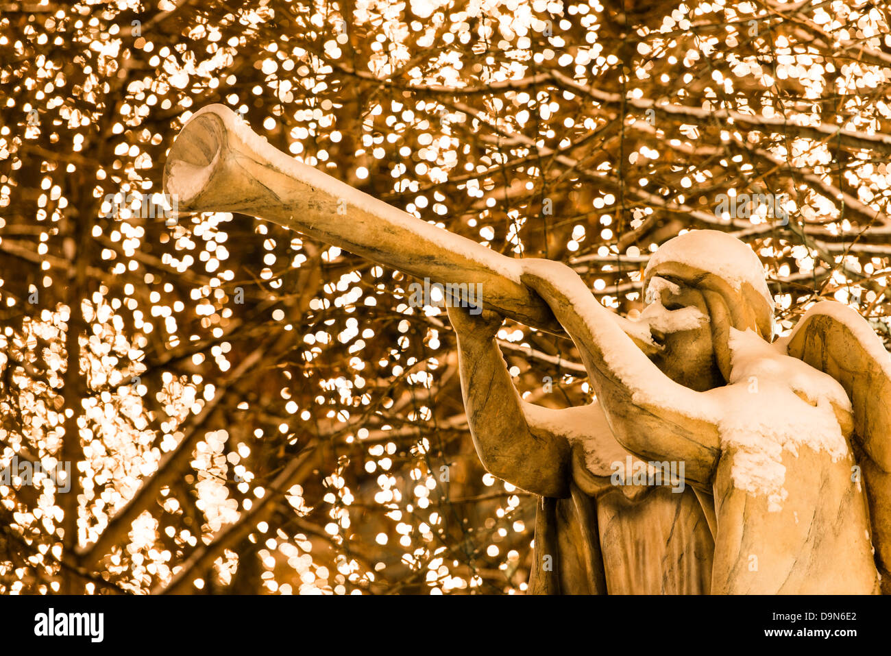 A statue of an angel with horn welcomes the holiday season in Rice Park ...