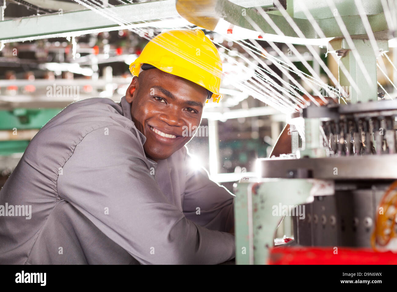 happy African American textile factory worker Stock Photo - Alamy