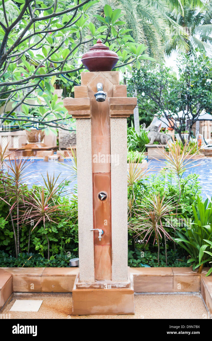 Outdoor shower at swimming pool in resort Stock Photo - Alamy