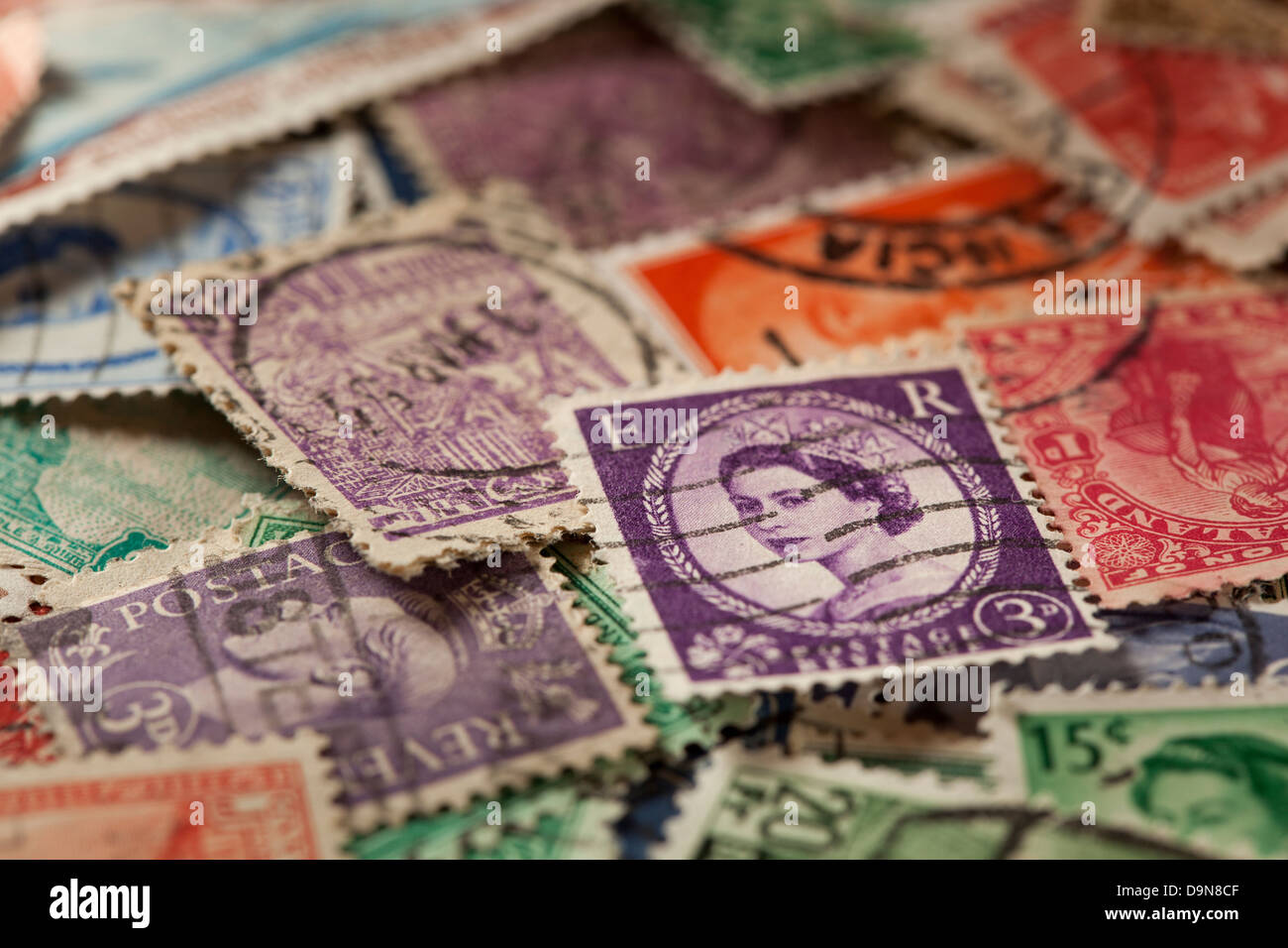 Colorful Vintage Used Postage Stamps in a pile Stock Photo - Alamy
