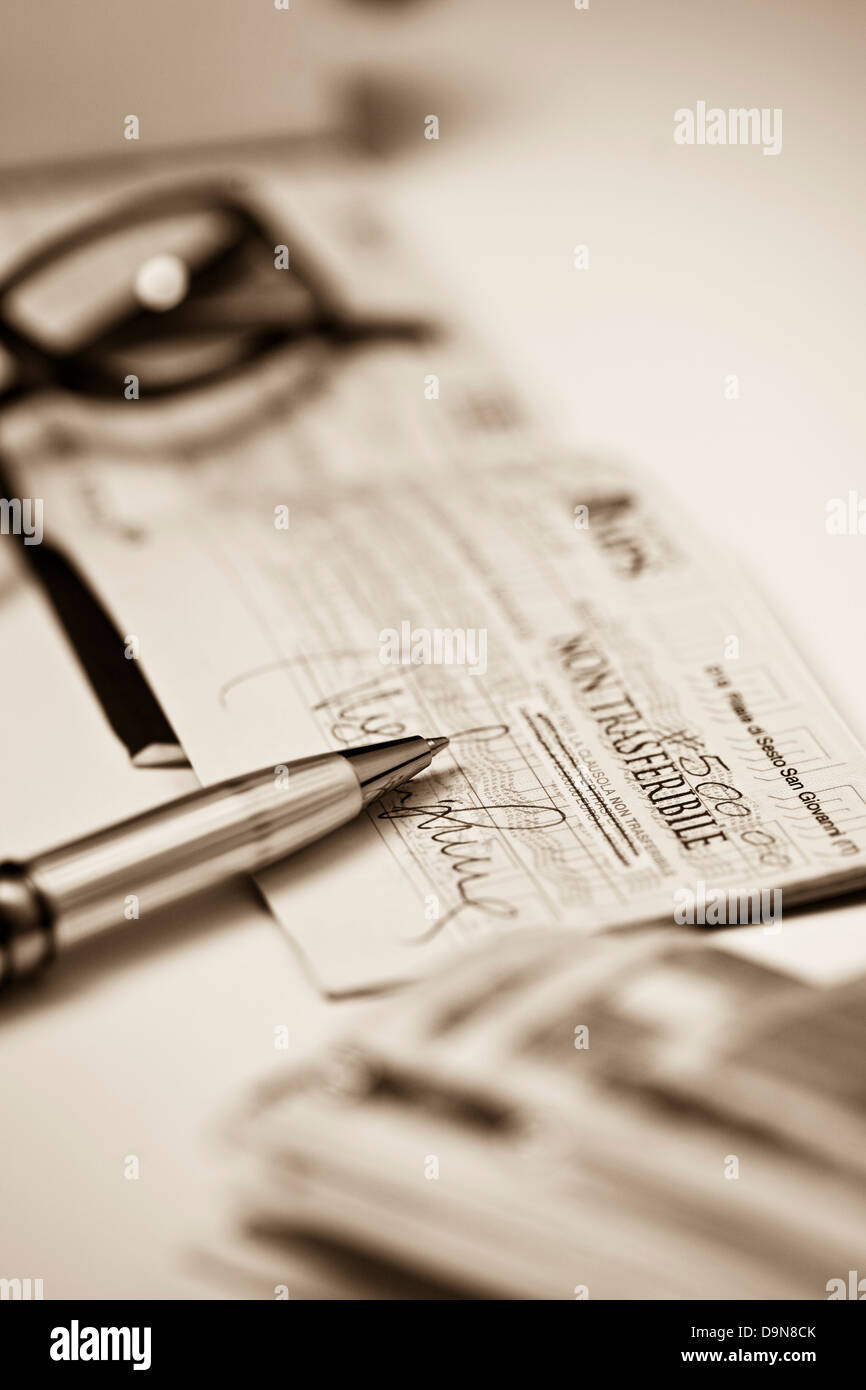 Signing cheques hi-res stock photography and images - Alamy