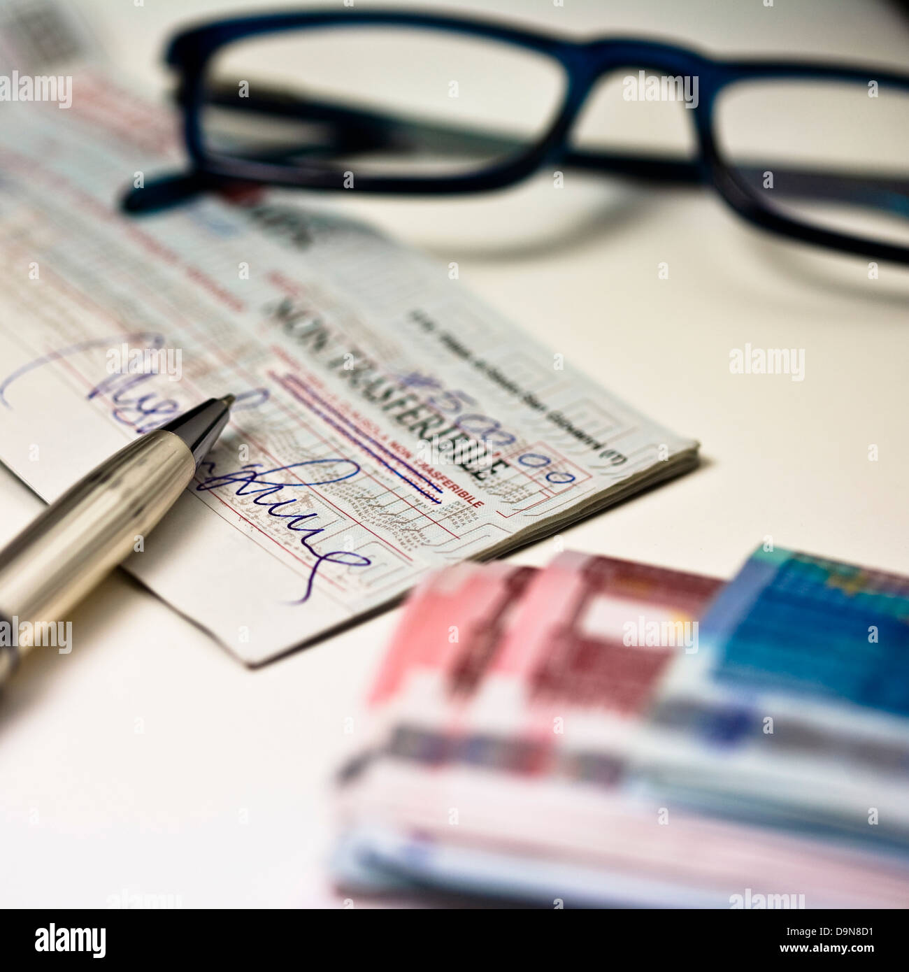 Signing cheques hi-res stock photography and images - Alamy