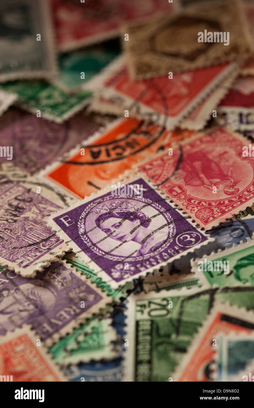 Colorful Vintage Used Postage Stamps in a pile Stock Photo - Alamy