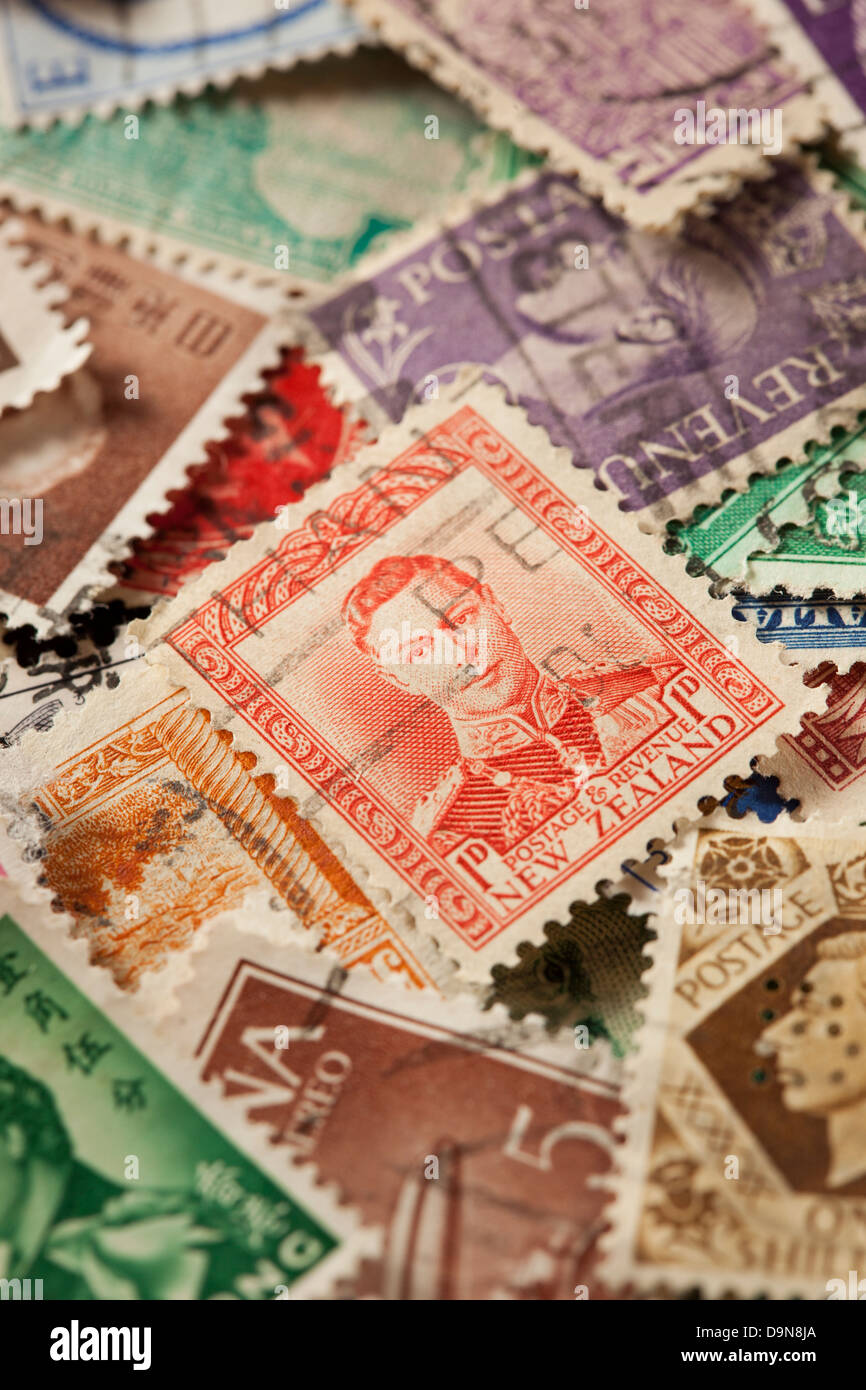 Colorful Vintage Used Postage Stamps in a pile Stock Photo - Alamy