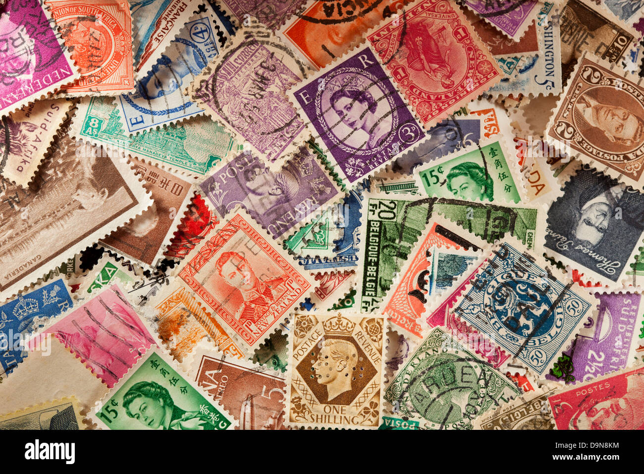 Used stamp collection in pile hi-res stock photography and images - Alamy