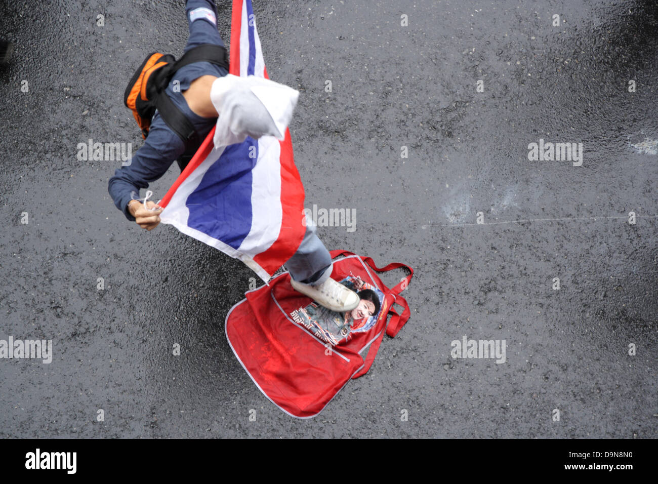 Bangkok , Thailand 23th June 2013 . A protester stomping on Yingluck ...