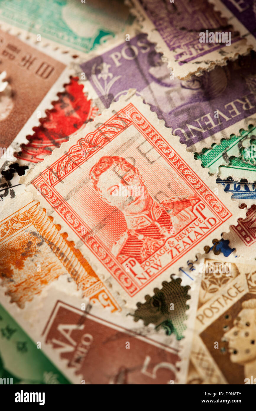 Colorful Vintage Used Postage Stamps in a pile Stock Photo - Alamy
