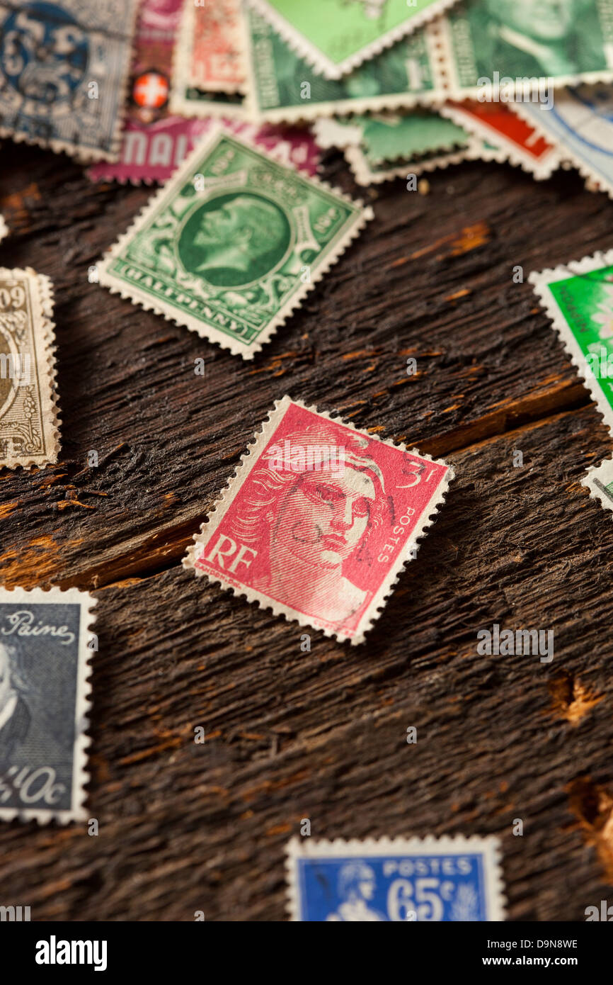 Colorful Vintage Used Postage Stamps in a pile Stock Photo - Alamy