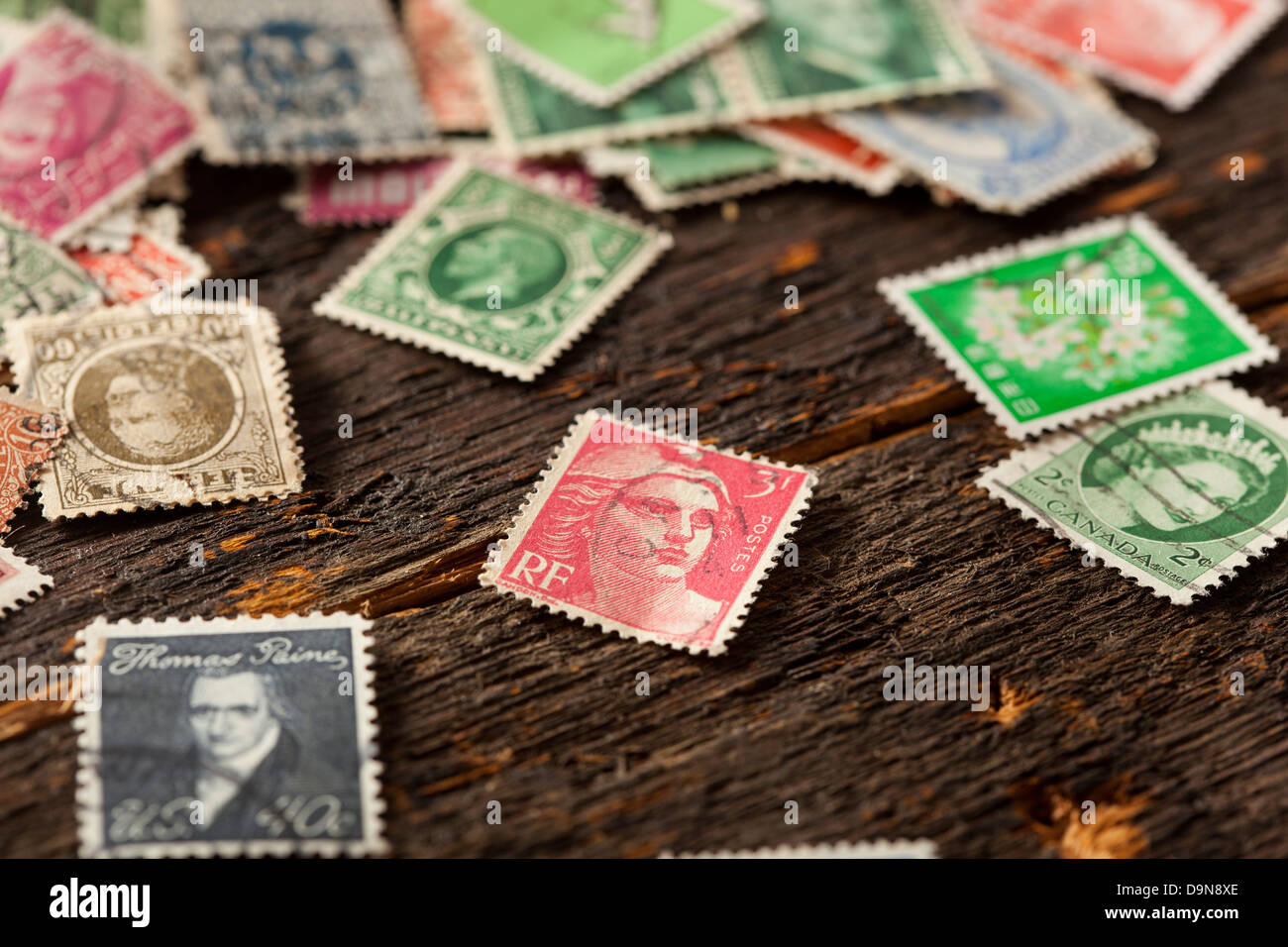 Colorful Vintage Used Postage Stamps in a pile Stock Photo - Alamy