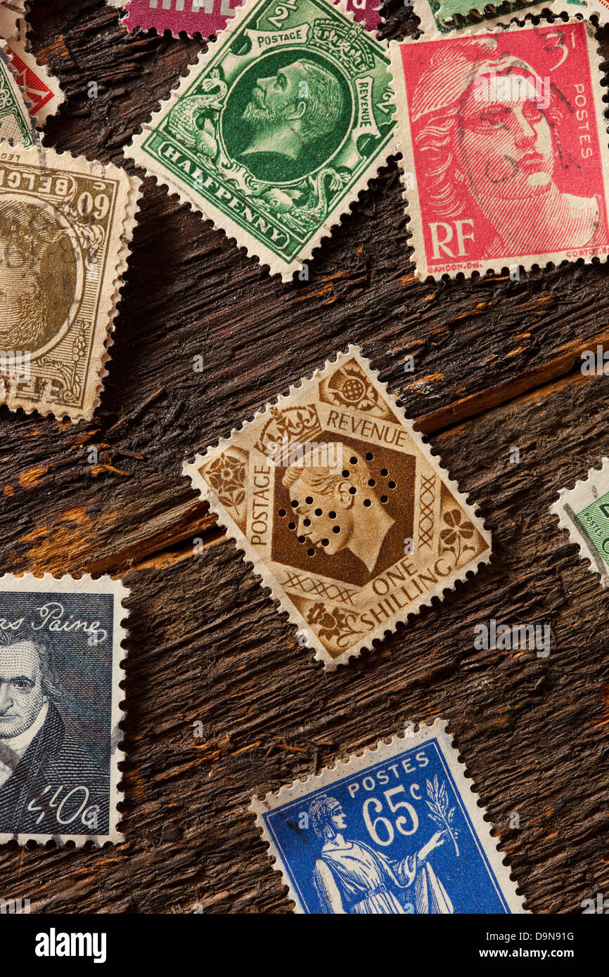 Colorful Vintage Used Postage Stamps in a pile Stock Photo - Alamy