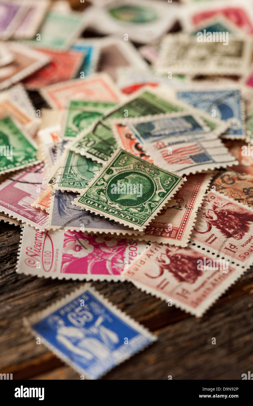 Colorful Vintage Used Postage Stamps in a pile Stock Photo - Alamy
