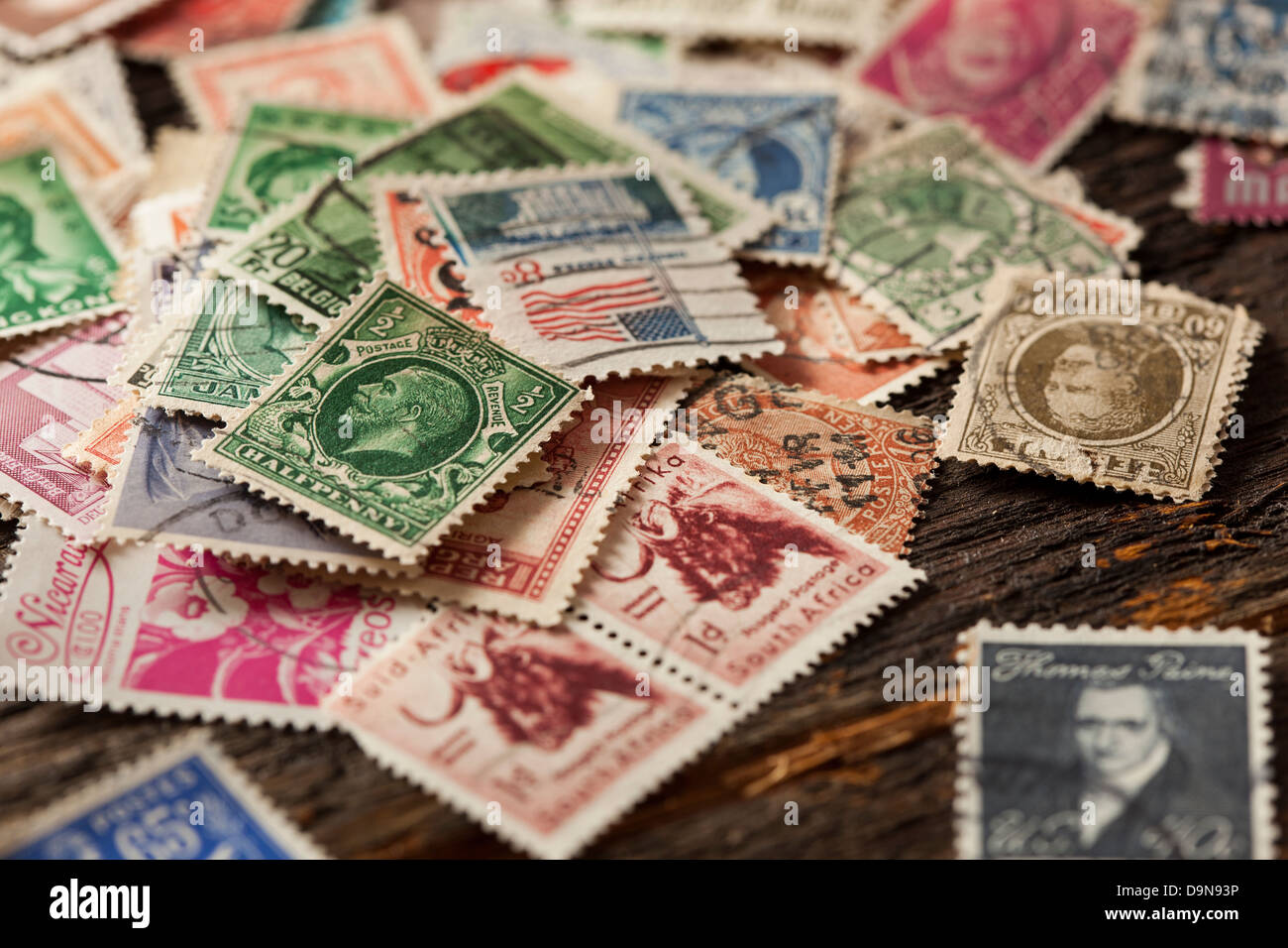 Colorful Vintage Used Postage Stamps in a pile Stock Photo - Alamy