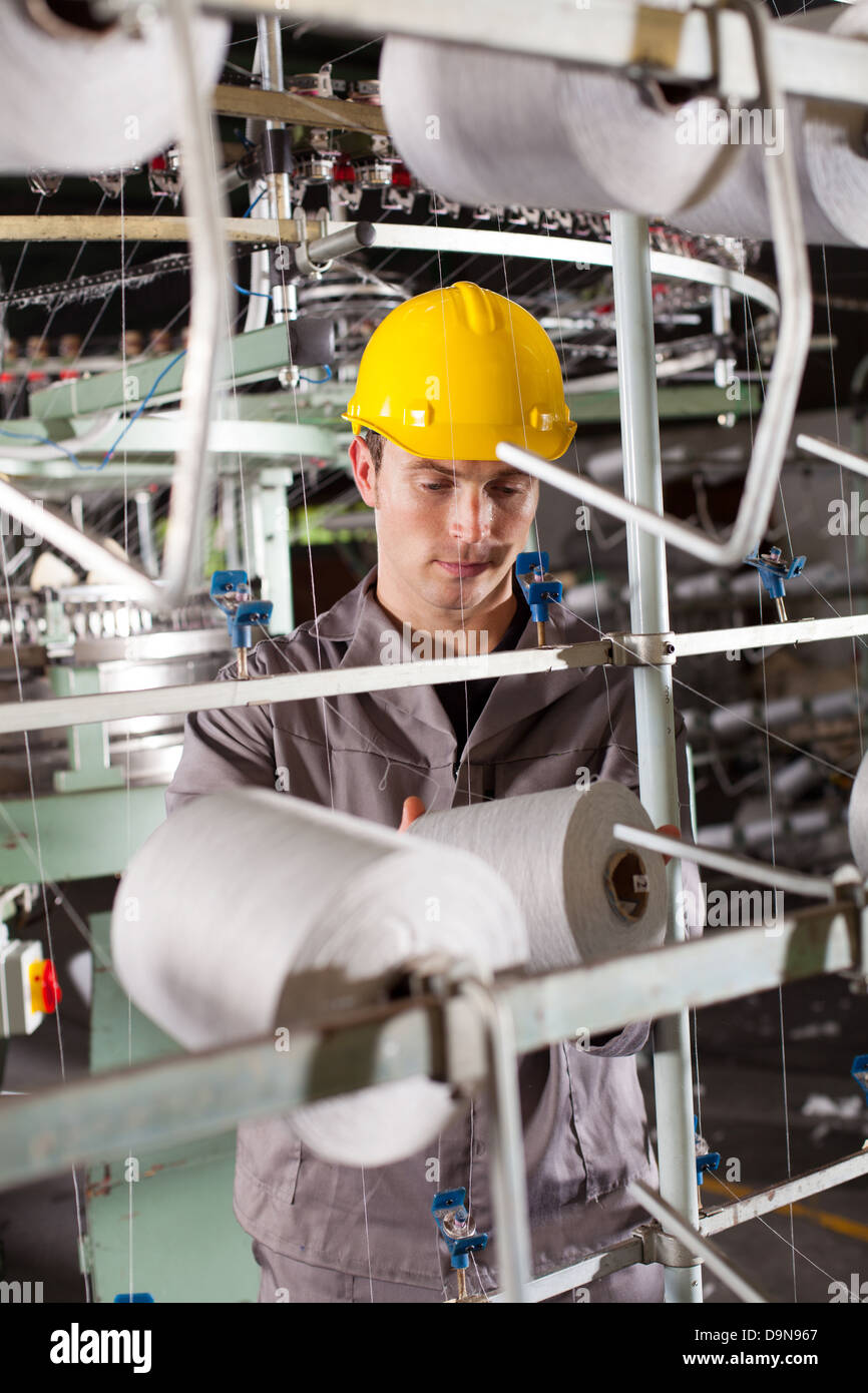 textile industrial worker working in factory Stock Photo - Alamy