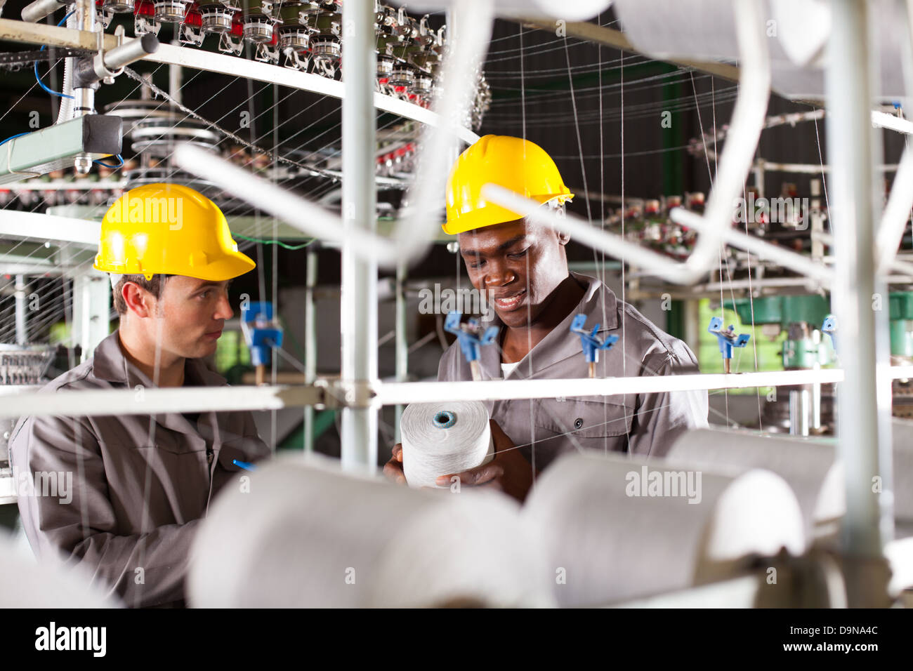 two textile workers at work Stock Photo - Alamy
