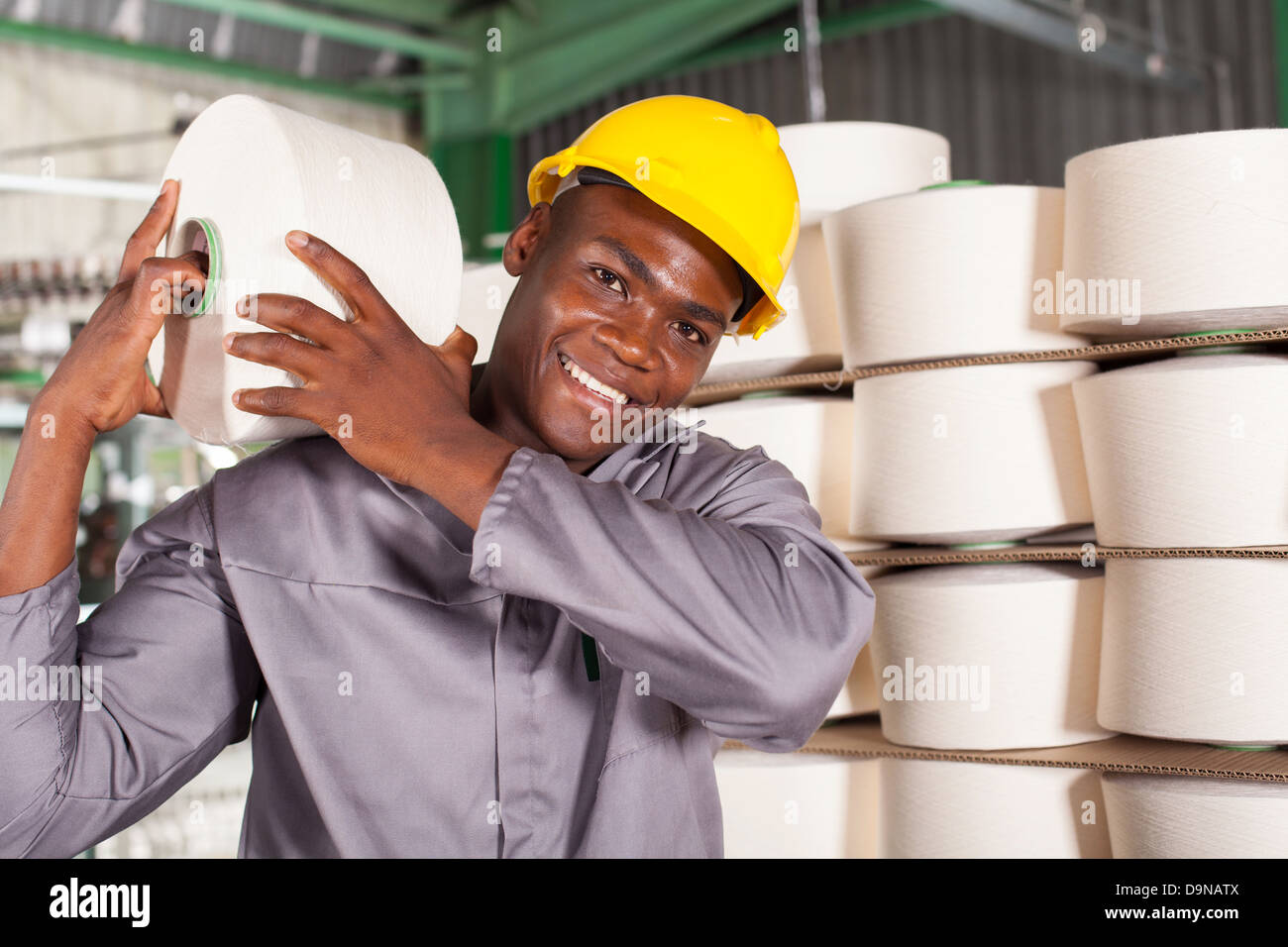 textile factory worker carrying raw material on his shoulder Stock ...