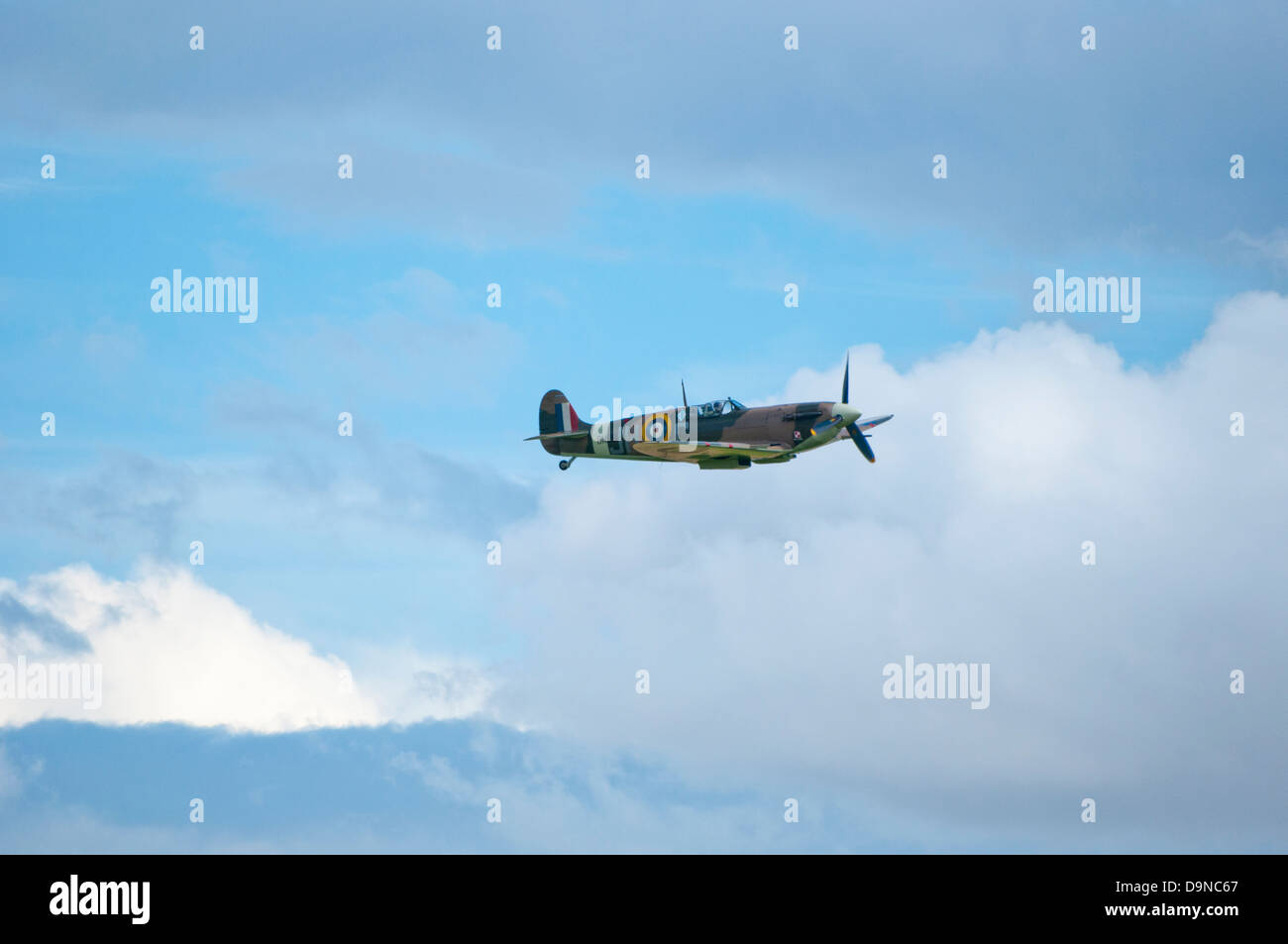 Supermarine Spitfire Mk. 5 Fighter aircraft flying against a blue sky ...