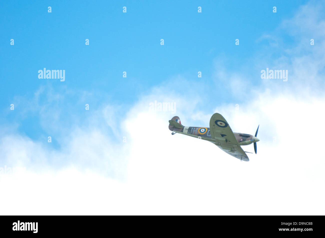 Supermarine Spitfire Mk. 5 Fighter aircraft flying against a blue sky ...