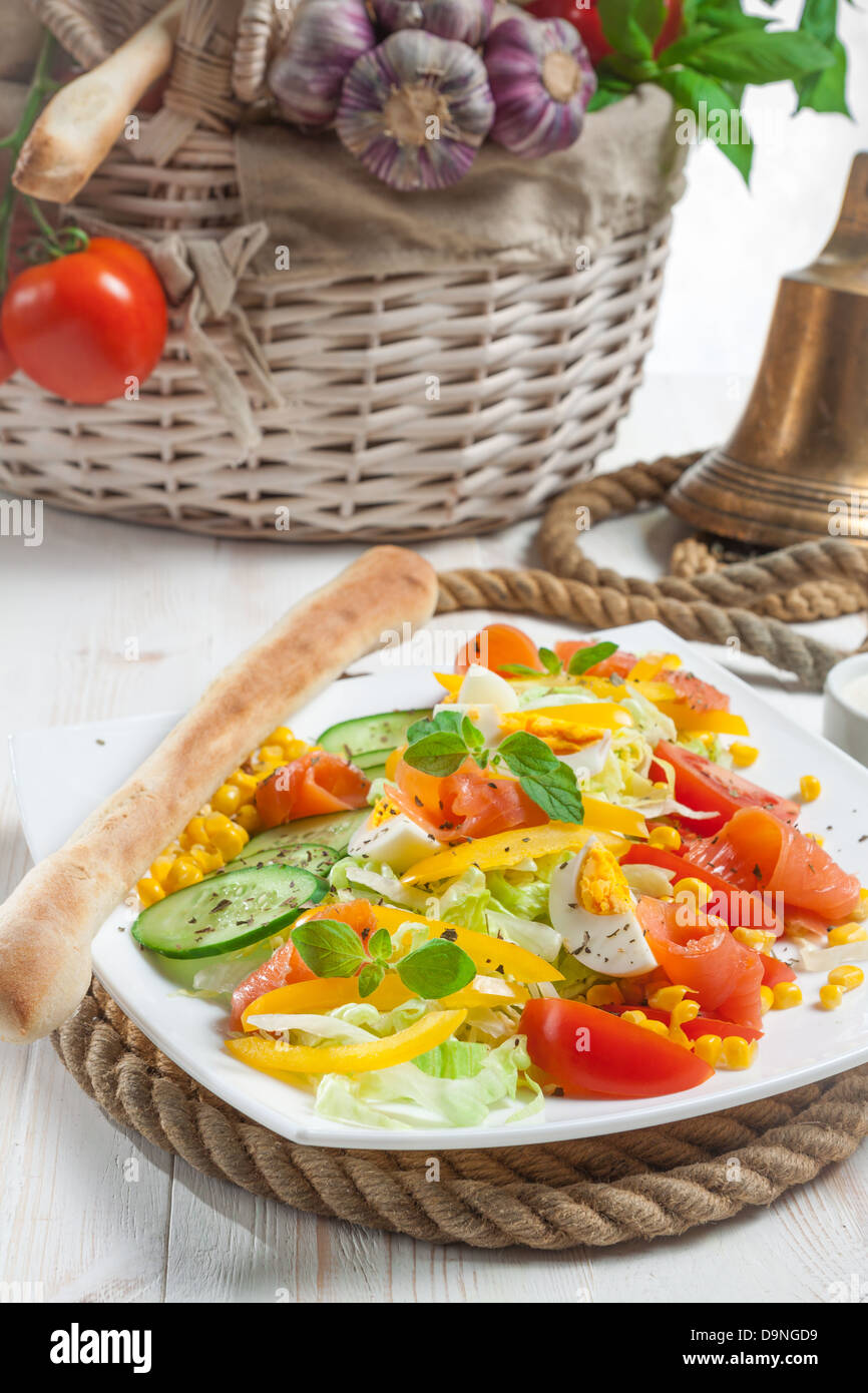 Vegetable salad served on sailing rope Stock Photo - Alamy