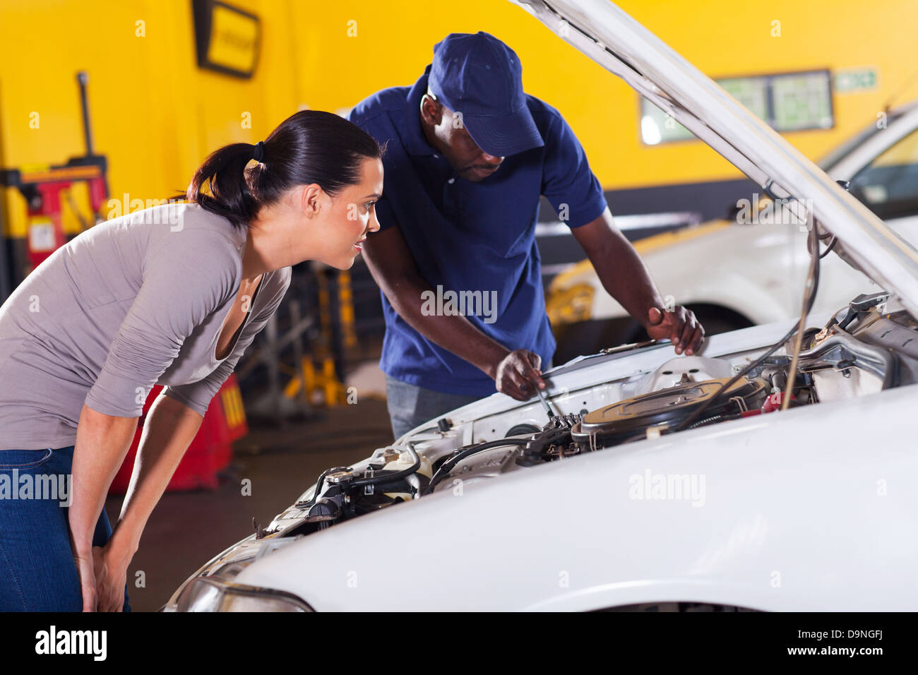 Woman fixing car hi-res stock photography and images - Alamy