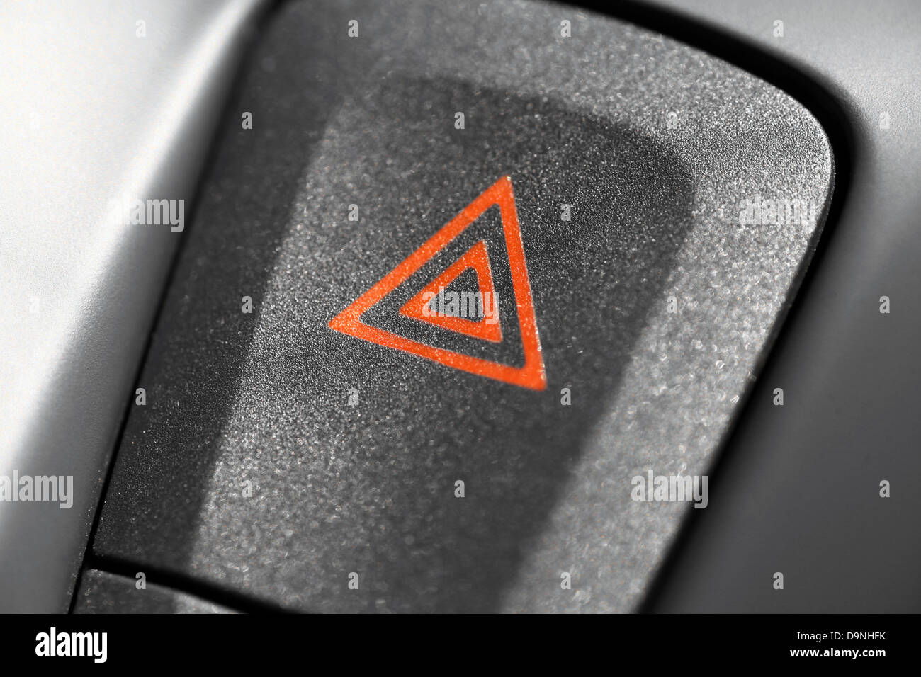 Detail of a warning button in a car Stock Photo - Alamy