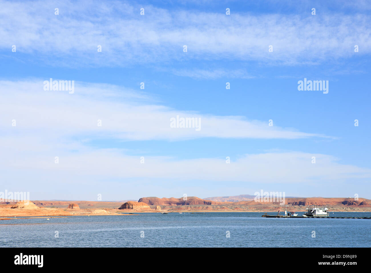 A houseboat under way in the Bullfrog Marina at Lake Powell in Utah ...
