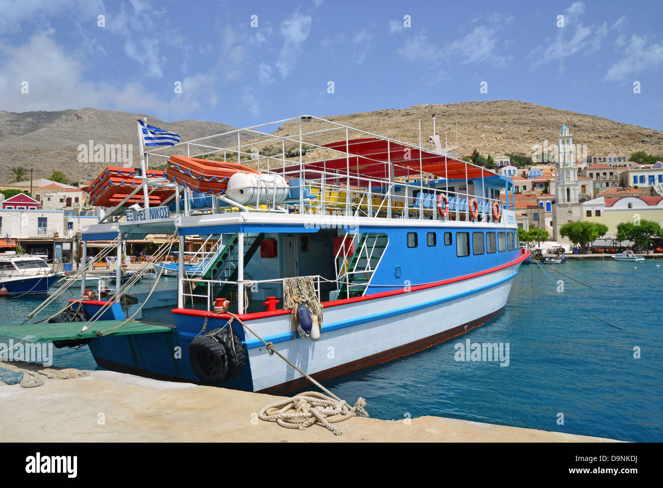 Ferry boat on waterfront, Port of Emporio, Halki (Chalki), Rhodes ...