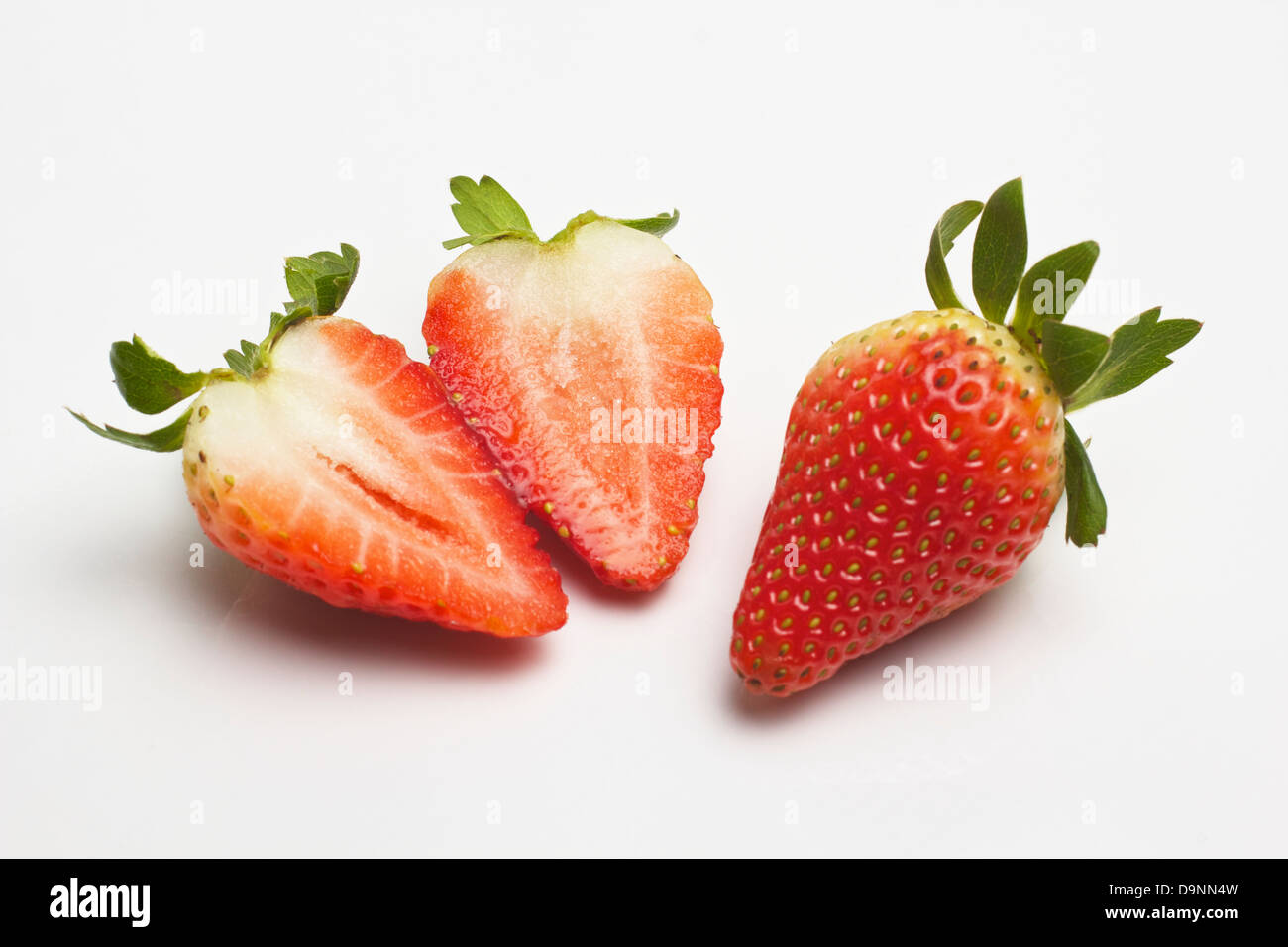 Two strawberries isolated on white background Stock Photo - Alamy