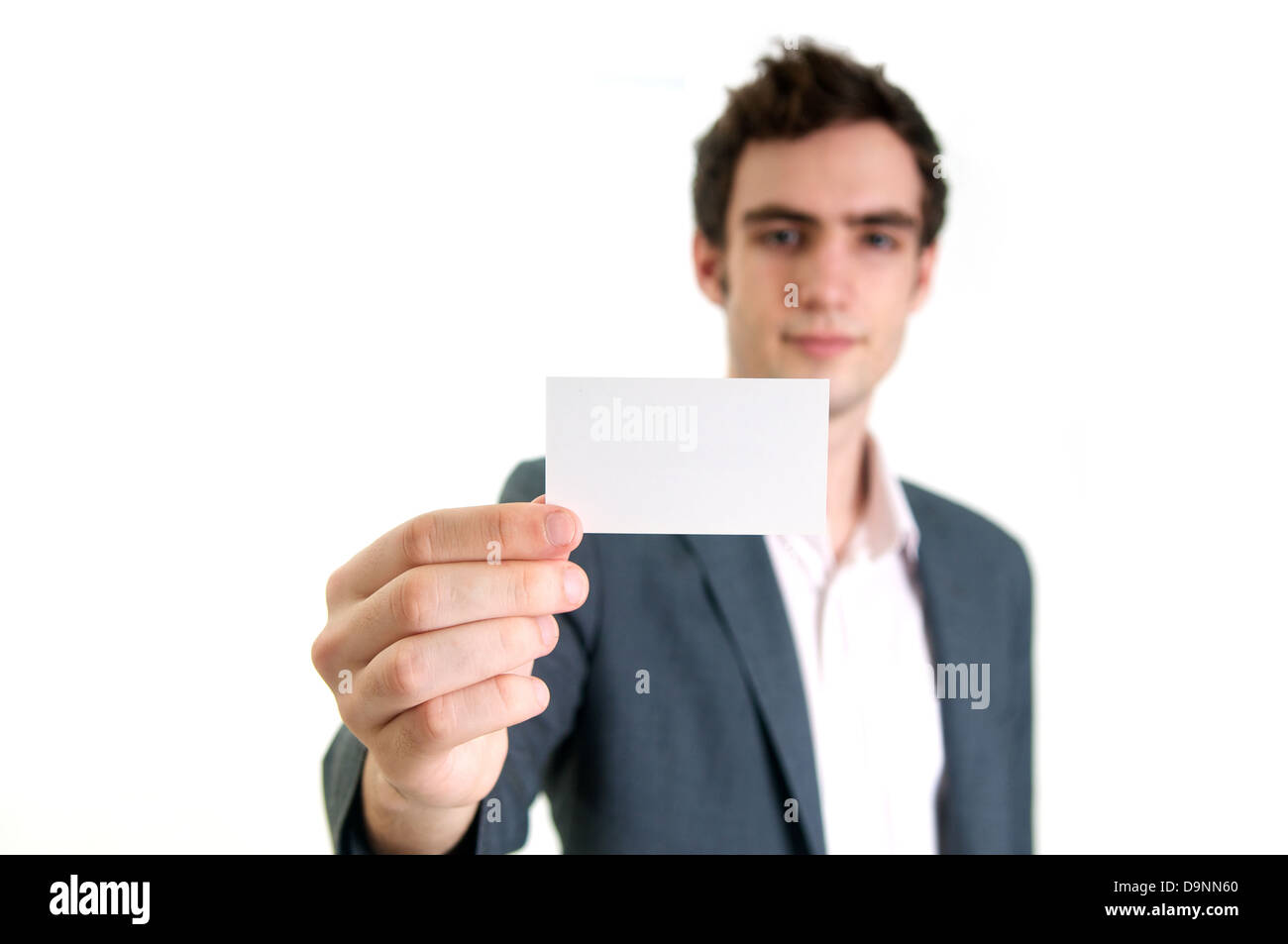 Professional young man holding business card Stock Photo - Alamy