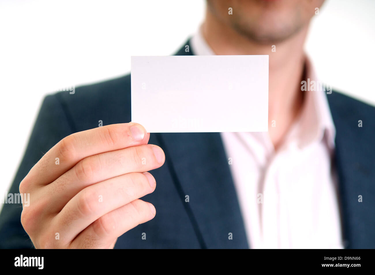 Professional young man holding business card Stock Photo - Alamy