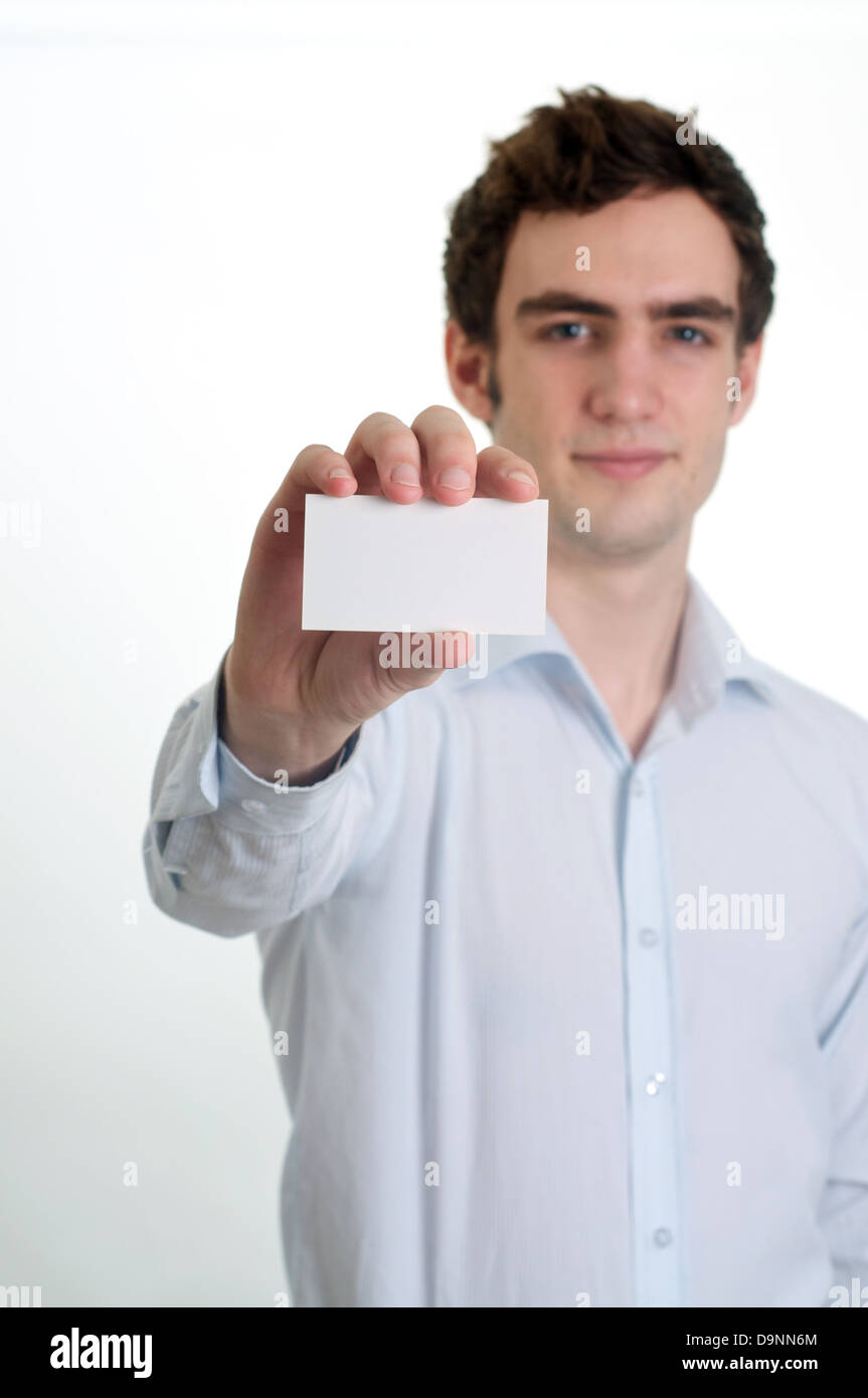 Professional young man holding business card Stock Photo - Alamy