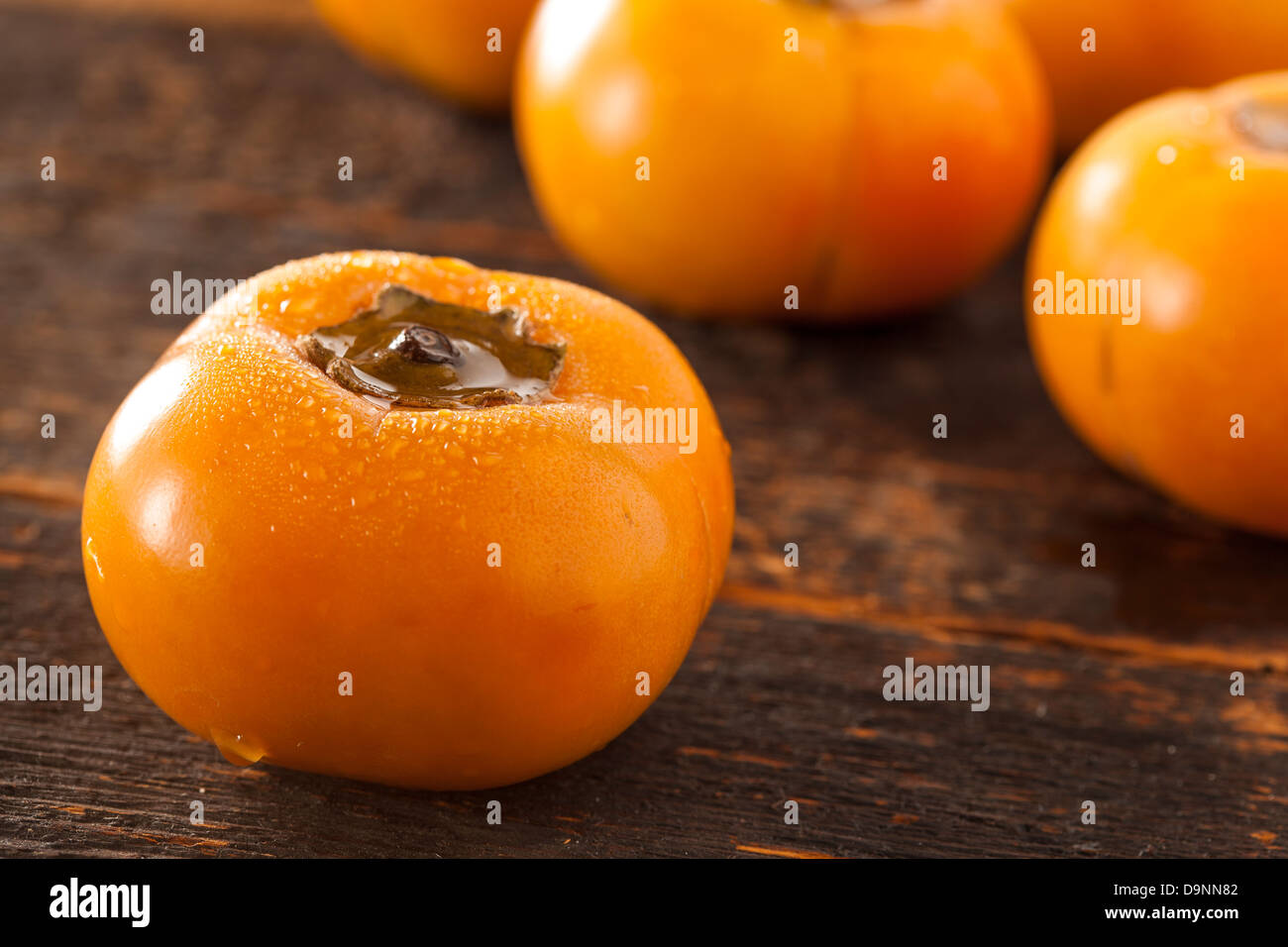 Juicy persimmon tropical fruit hi-res stock photography and images - Alamy