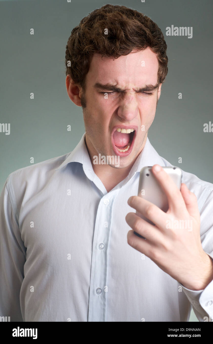 screaming man on mobile phone Stock Photo - Alamy