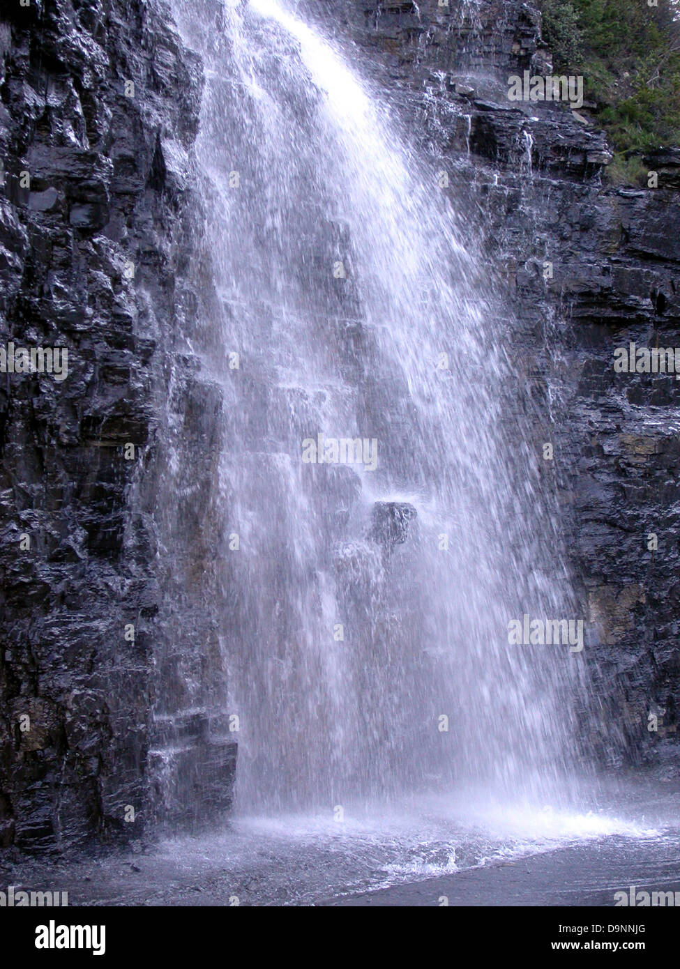 A waterfall in Glacier National Park, one of the park’s many natural ...