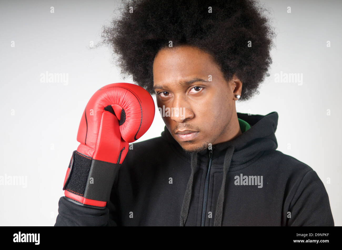 Black Boxer with red boxing gloves Stock Photo - Alamy