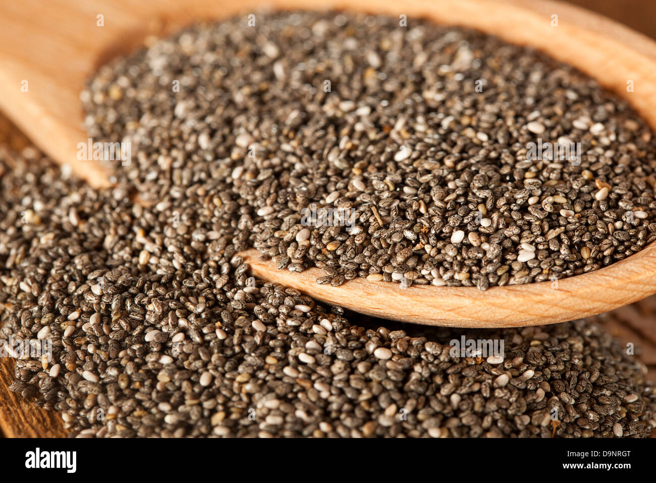 Organic Dry Black and White Chia Seeds against a background Stock Photo ...