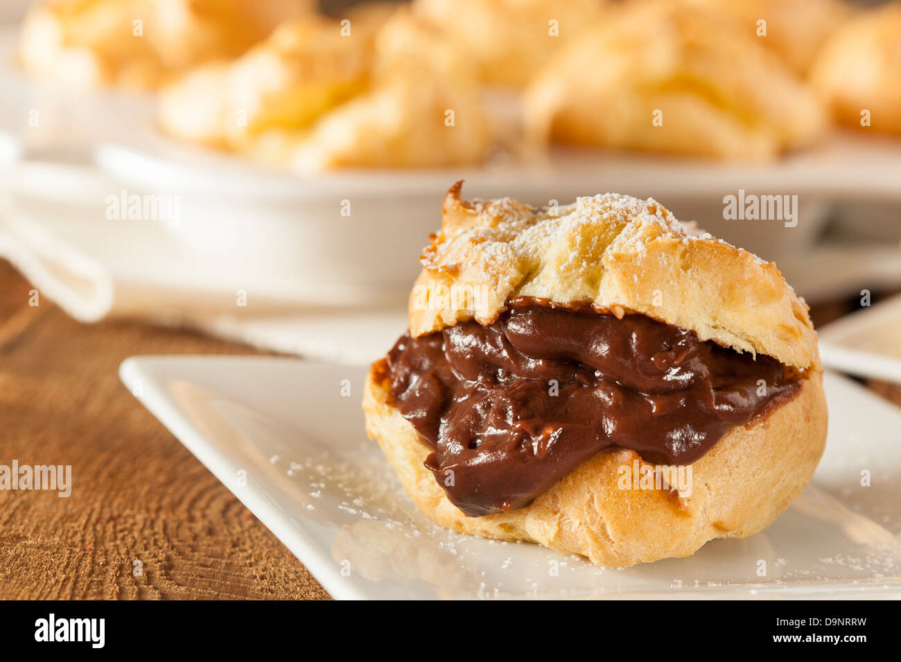 Homemade Chocolate Cream Puffs against a background Stock Photo - Alamy