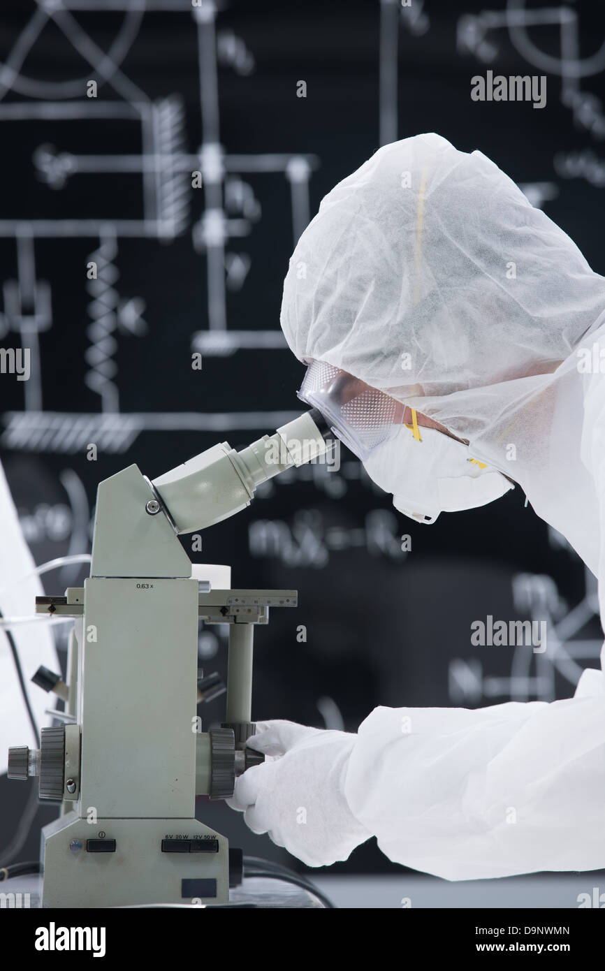 close-up of scientist analyzing molecules under microscope on a lab ...
