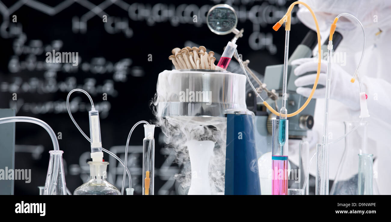 close-up of laboratory tools and chemical reactions in a chemistry lab ...