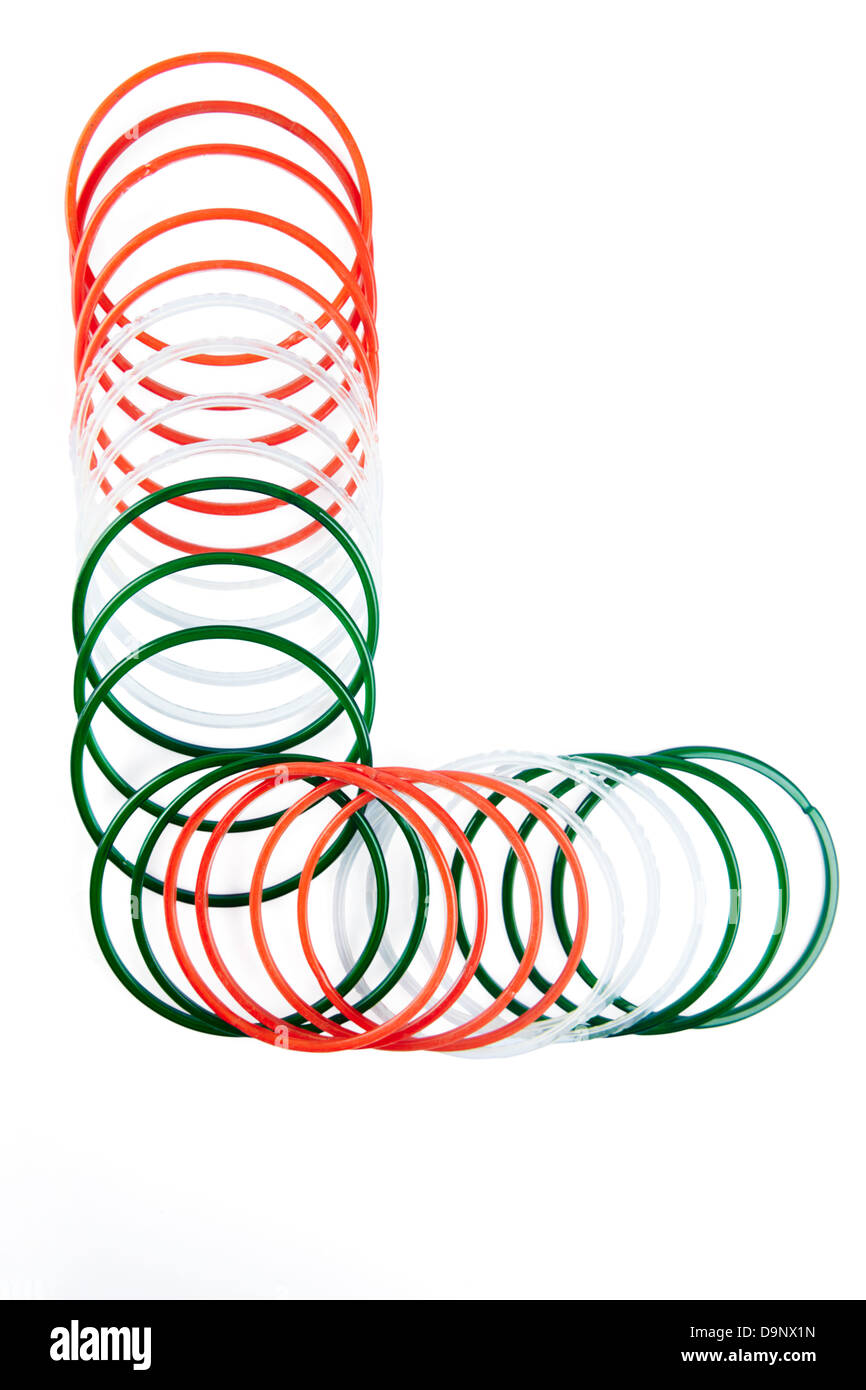 Tri coloured bangles arranged in the shape of letter L Stock Photo - Alamy