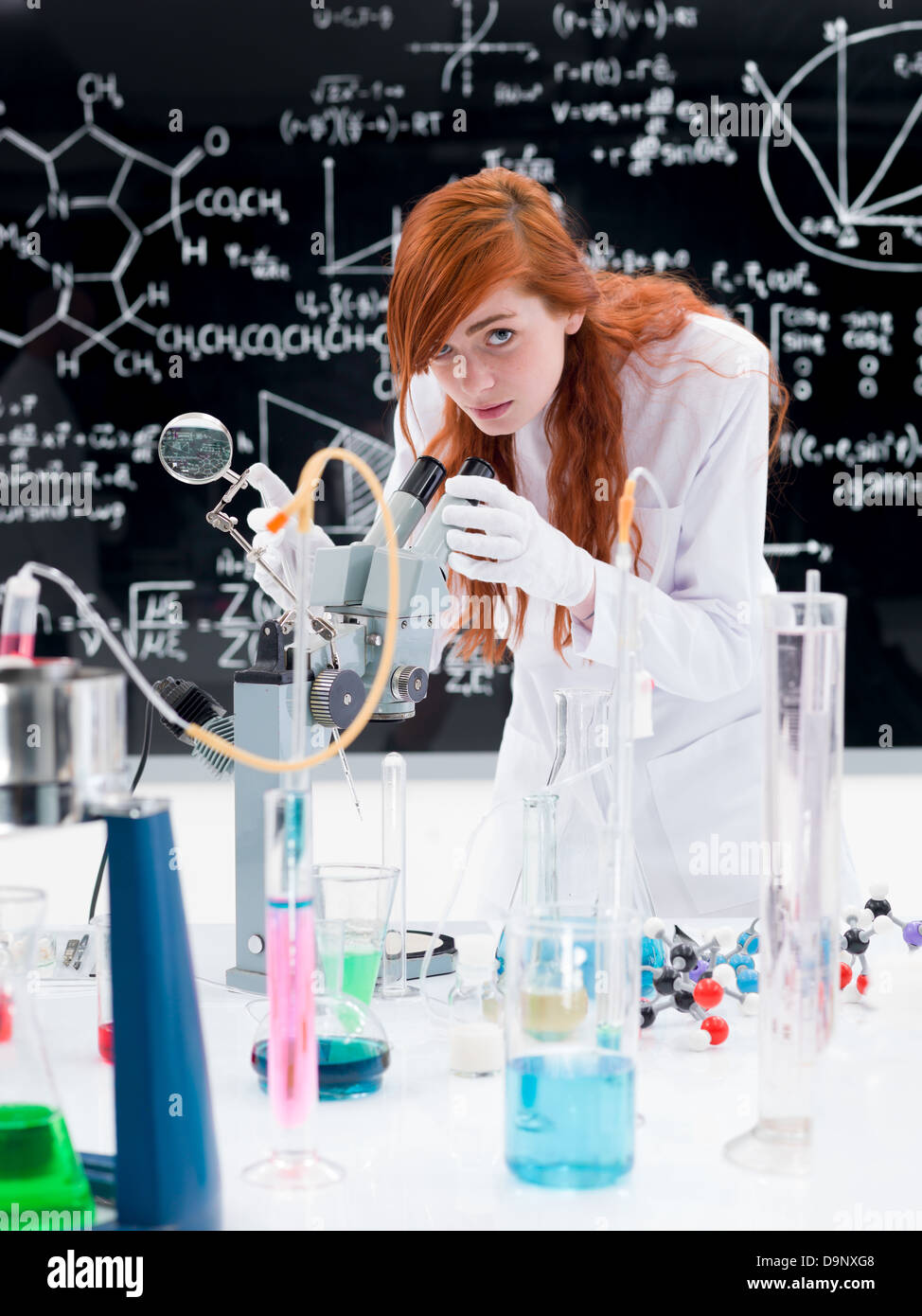 close-up of student looking in the camera in a chemistry lab around the ...