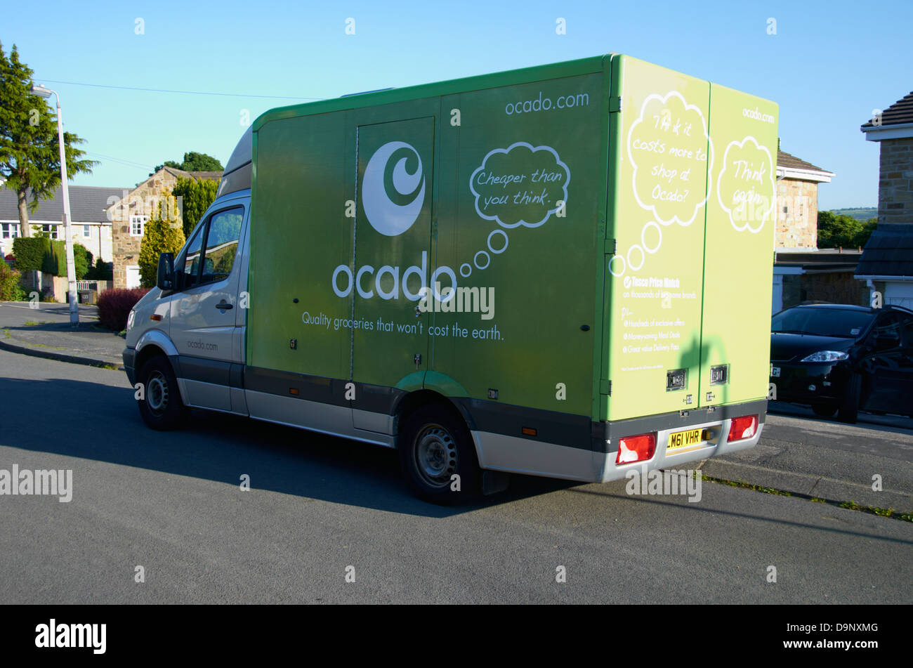 Ocado delivery van making deliveries to a suburban street Stock Photo ...